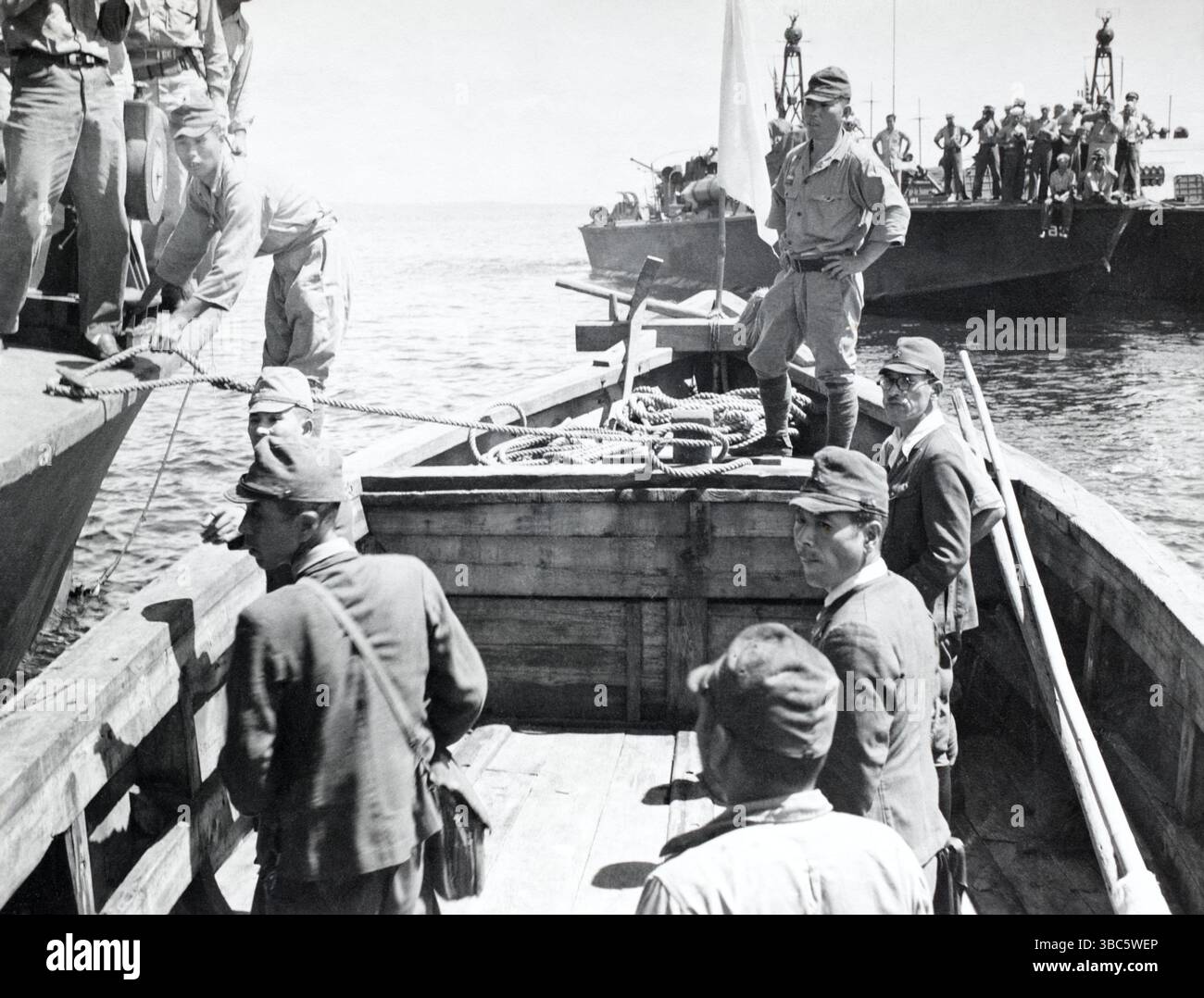 A Japanese boat making contact with a squadron of US torpedo boats ...