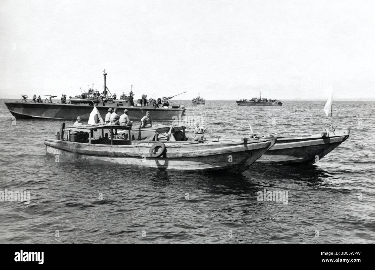 A Japanese boat making contact with a squadron of US torpedo boats ...