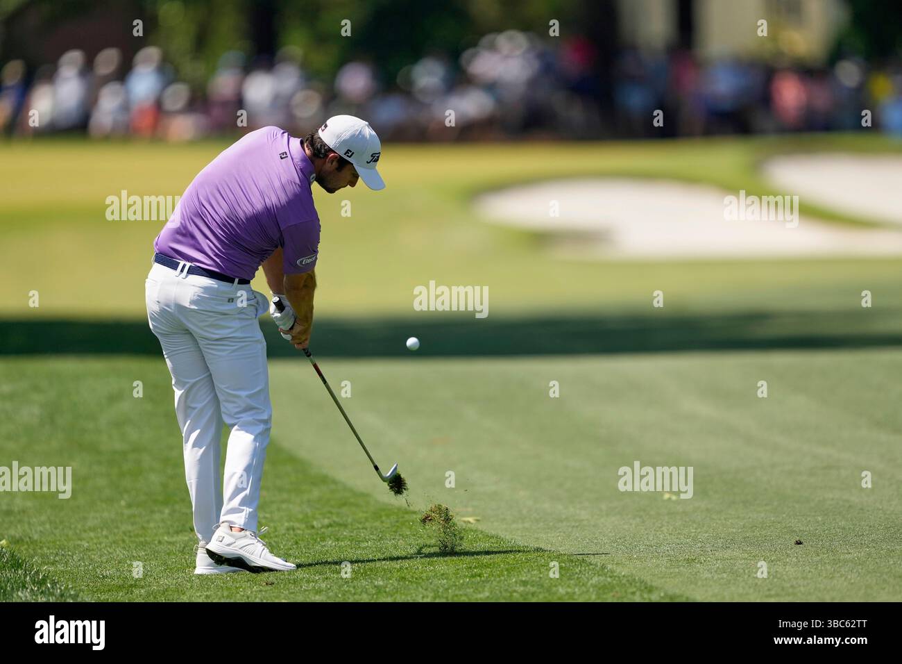 Davis Riley hits from the rough on the third hole during the final ...