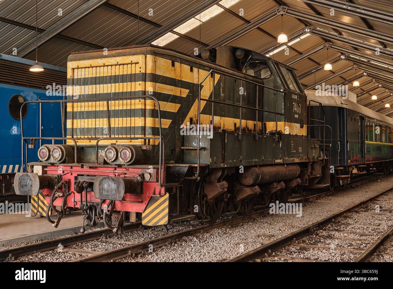 Aged industrial diesel locomotive 7408 Uranus (1977) with faded paint ...