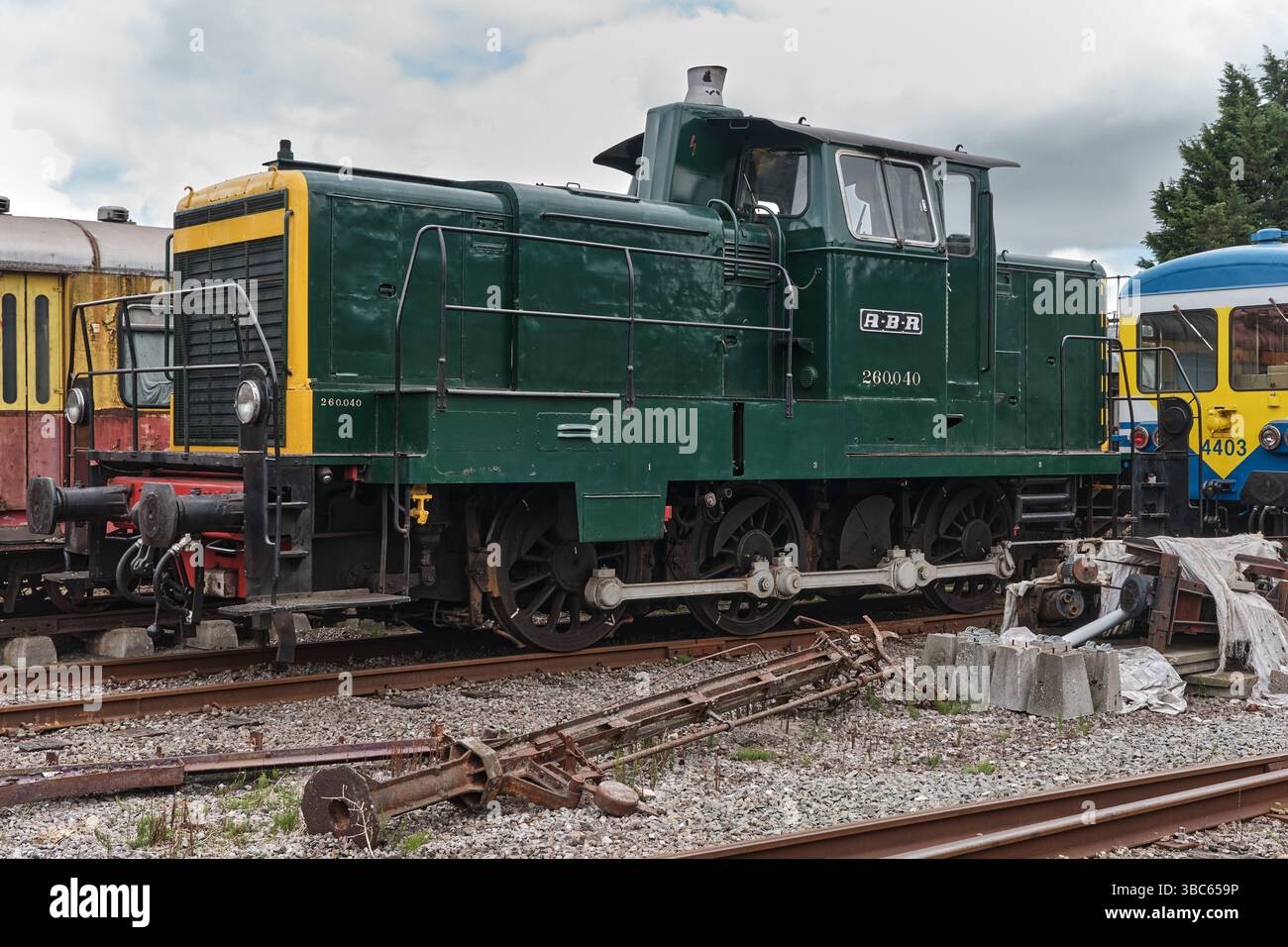 Aged industrial diesel locomotive 8040 with green and yellow paint and ...