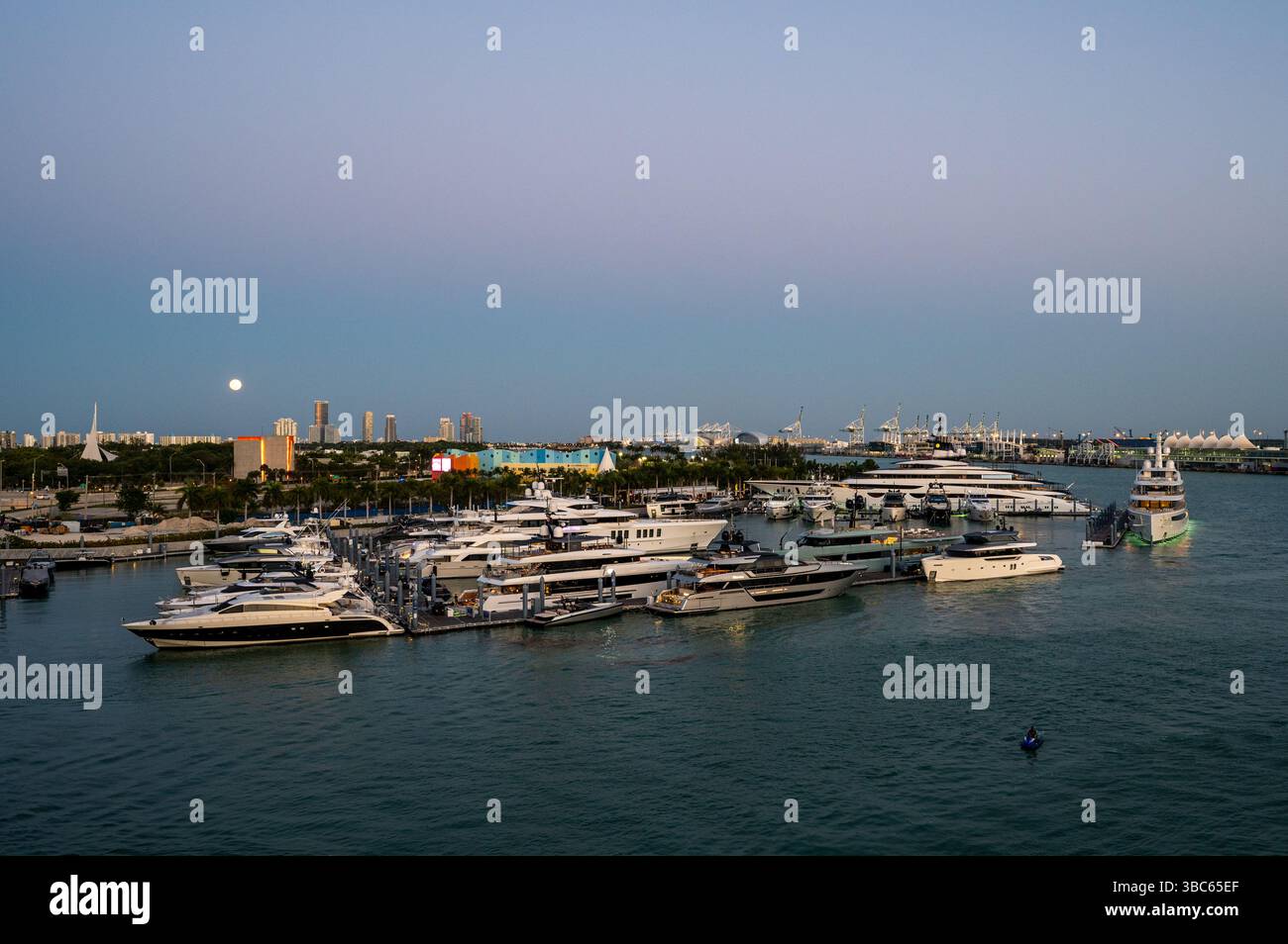 Miami, Florida - April 12, 2025: Moon rising over yachts docked at Deep ...