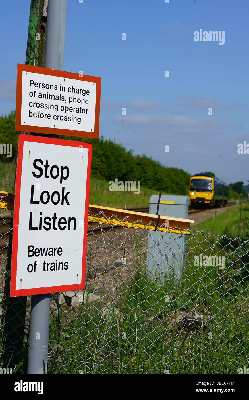 Signs at railroad crossings warning of an approaching train. Dorking ...