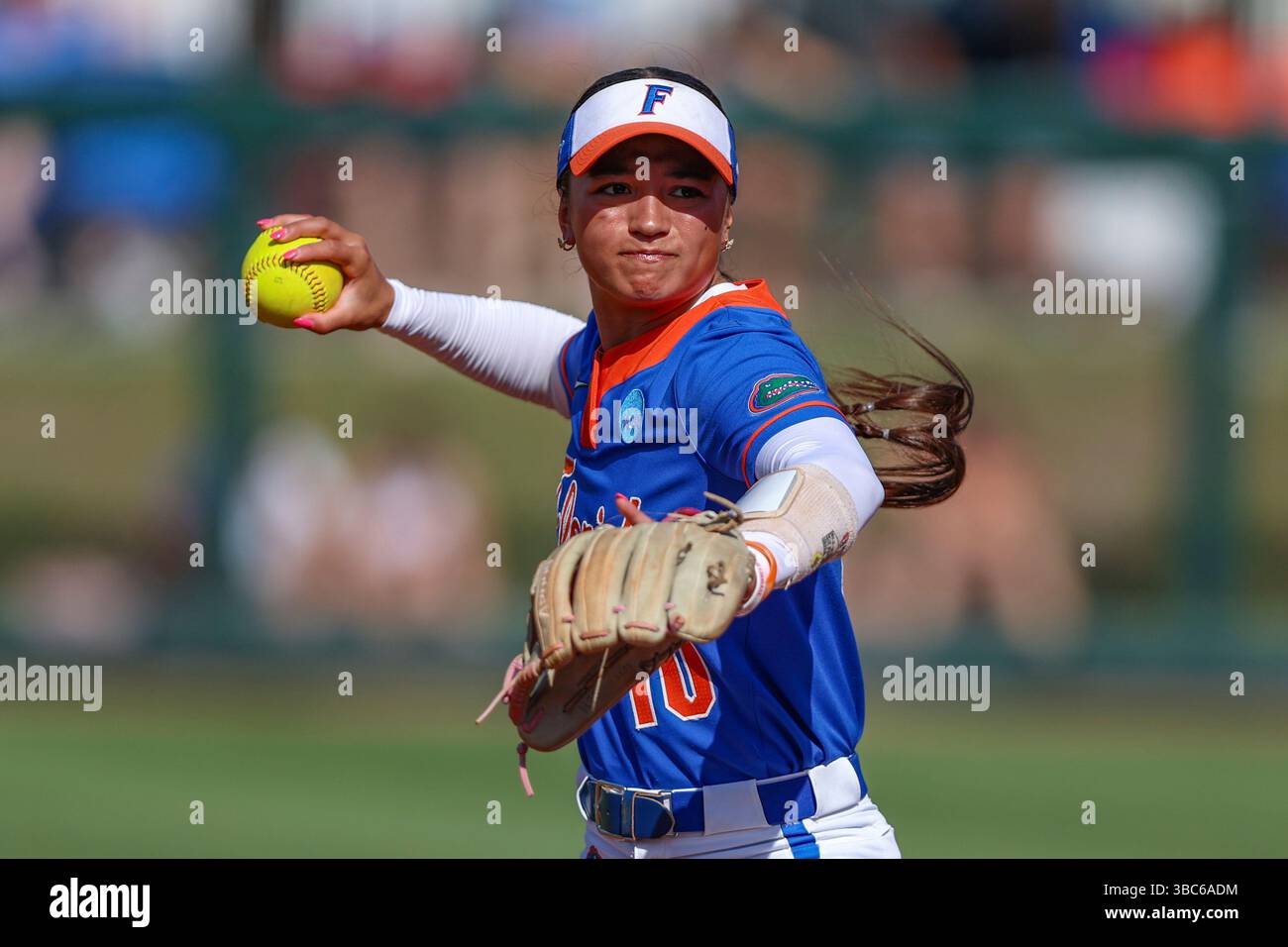 Florida infielder Gabi Comia (10) warms up before an NCAA regional ...