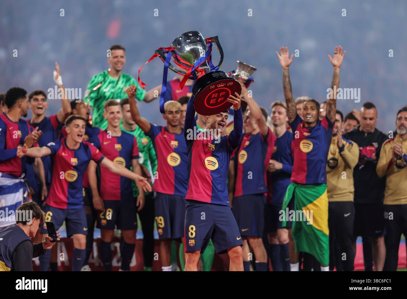 Pedro Gonzalez Pedri of FC Barcelona celebrates with the trophy after ...