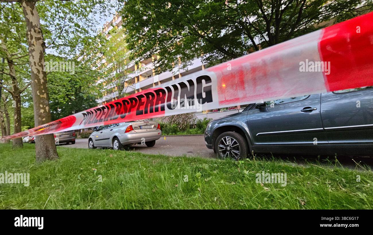 Halle, Germany. 18th May, 2025. A police cordon is in place at the ...