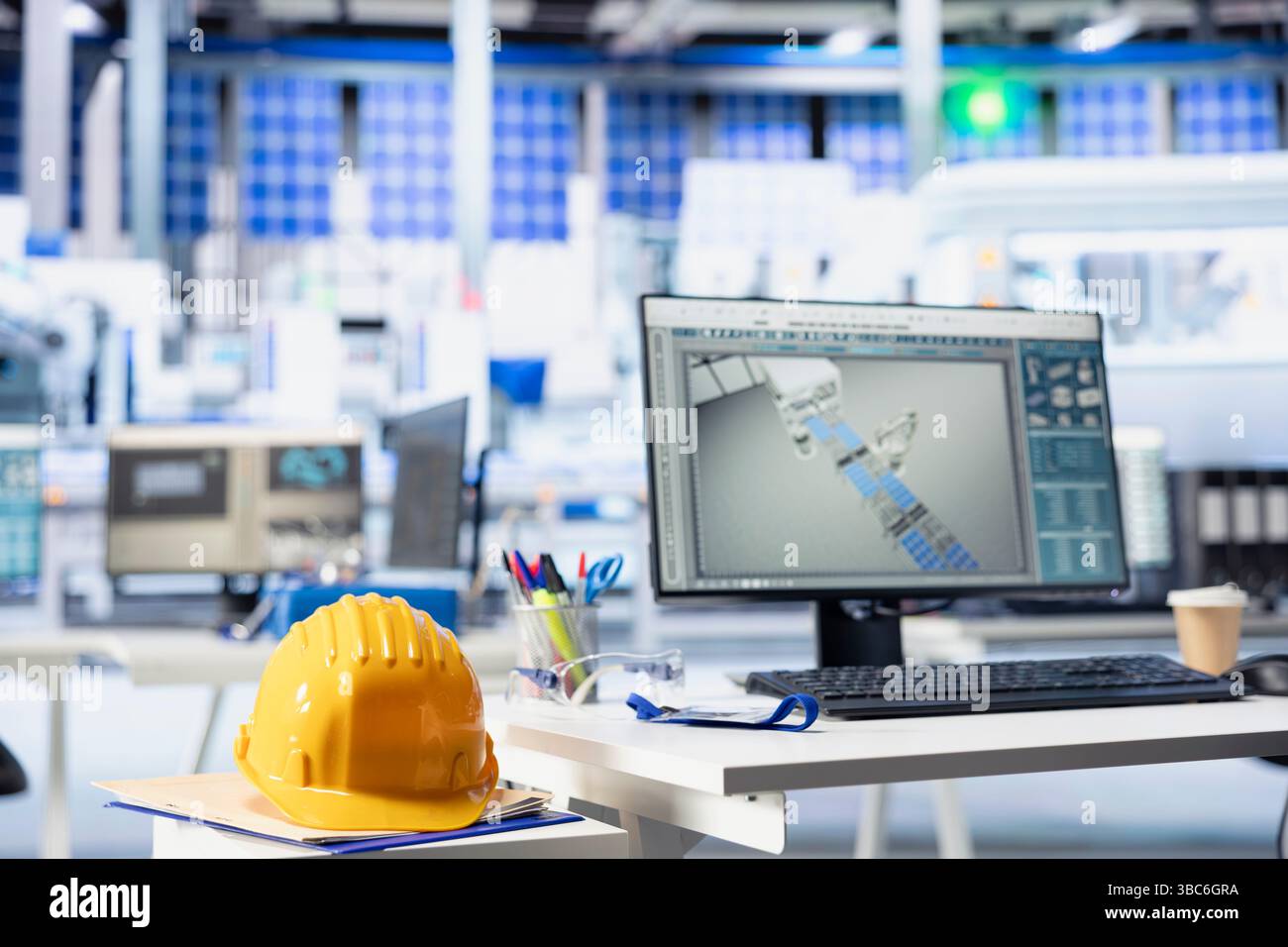 CAD program on PC display in photovoltaics factory used for designing ...