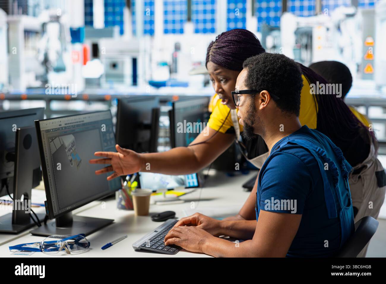 African american engineering team doing quality control on computer ...