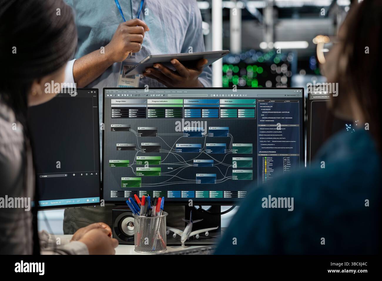 Close up of data center programmers using PC to visualize artificial intelligence neural ...