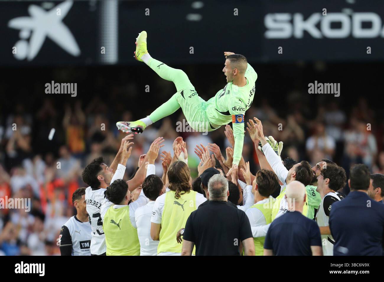 Jaume Domenech of Valencia is bounced in the air by his teammates after ...