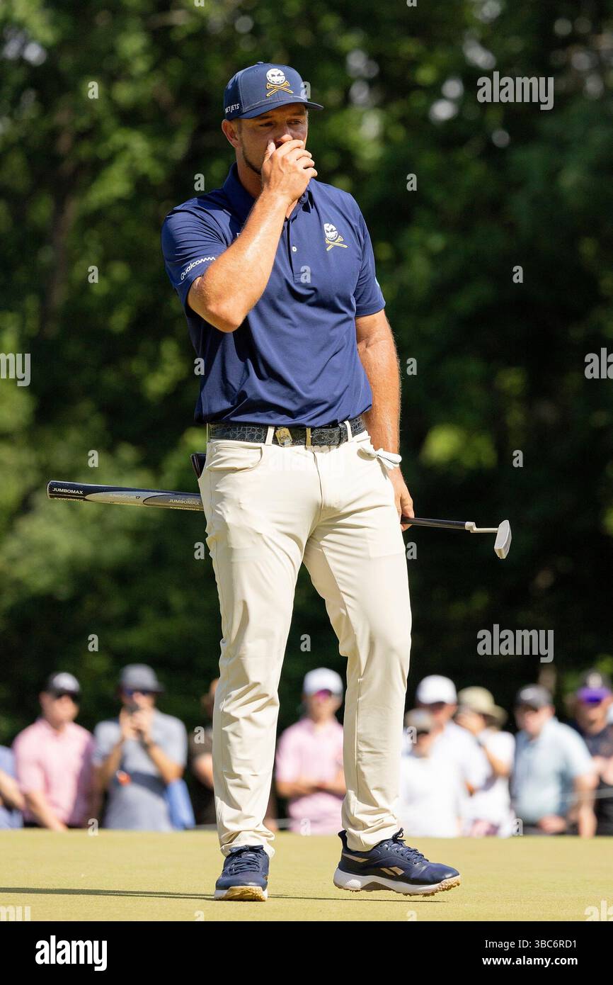 Captain Bryson DeChambeau of Crushers GC reacts to his putt on the 11th ...