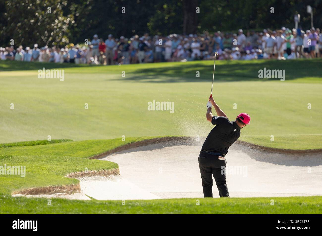 Captain Jon Rahm of Legion XIII hits his shot from a bunker on the 11th ...