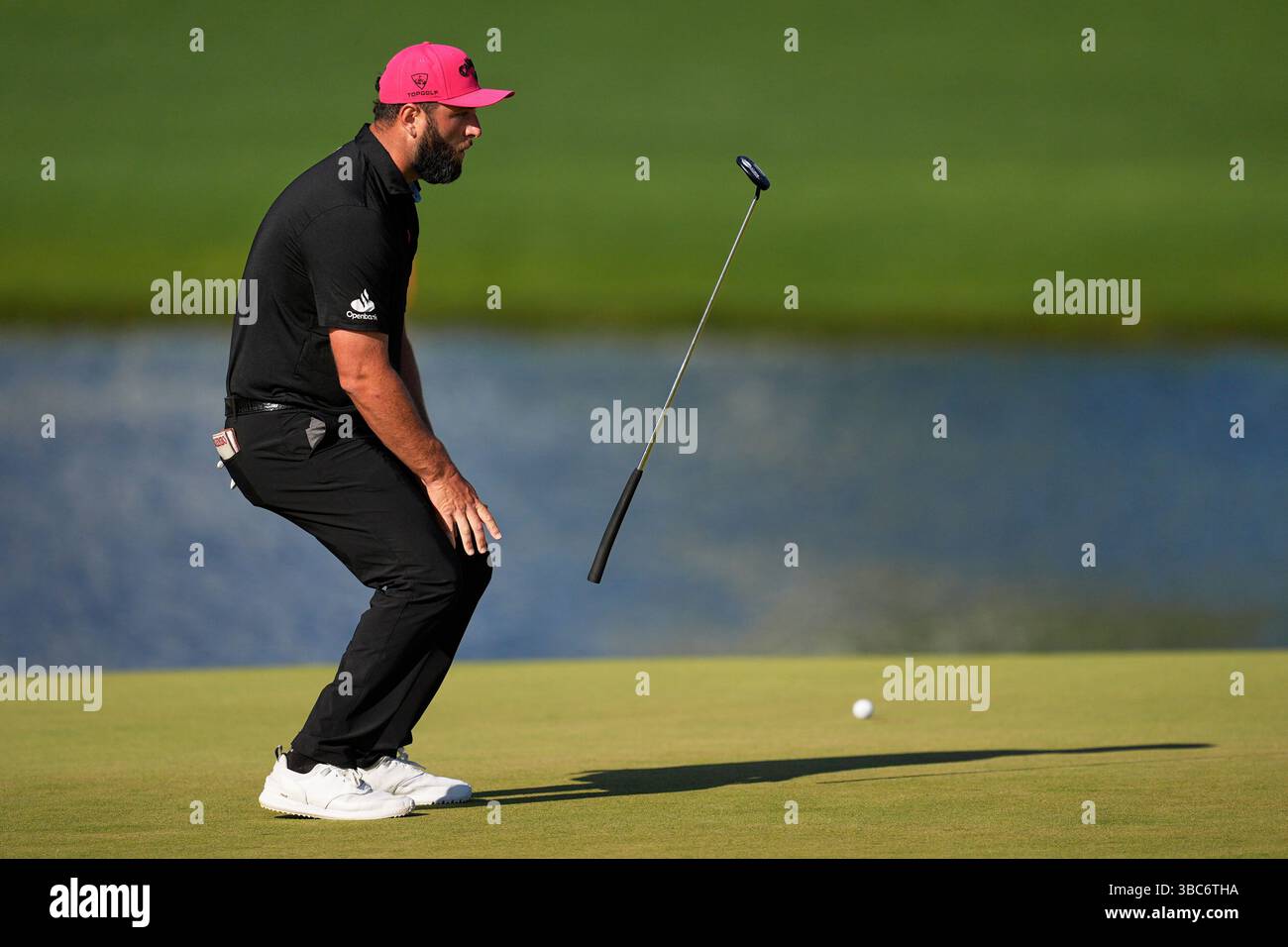 Jon Rahm, of Spain, reacts after missing a putt on the 16th hole during ...