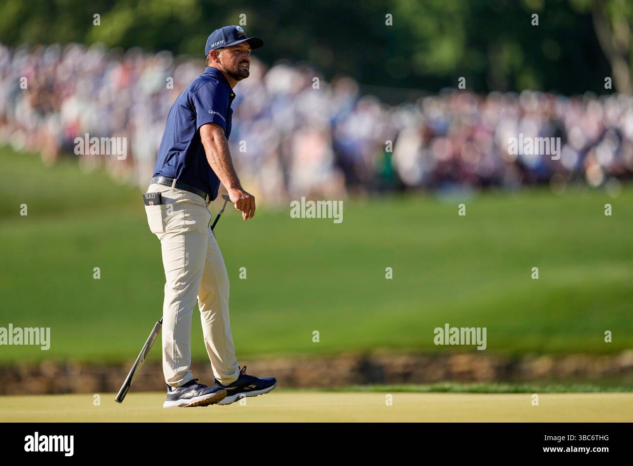 Bryson DeChambeau reacts after missing a putt on the 17th hole during ...