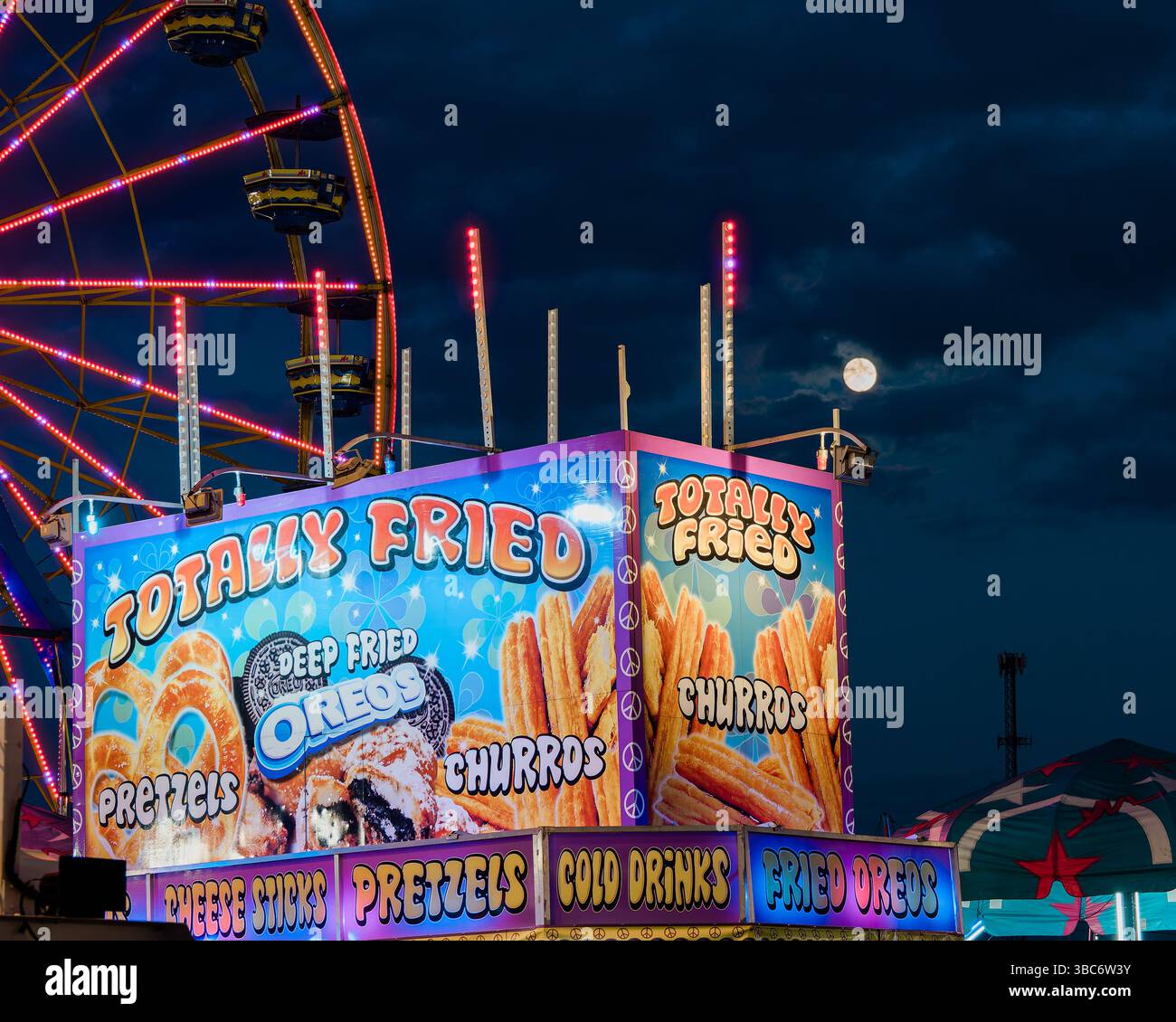 Carnival food vendor booth on the midway at the Alabama National Fair ...