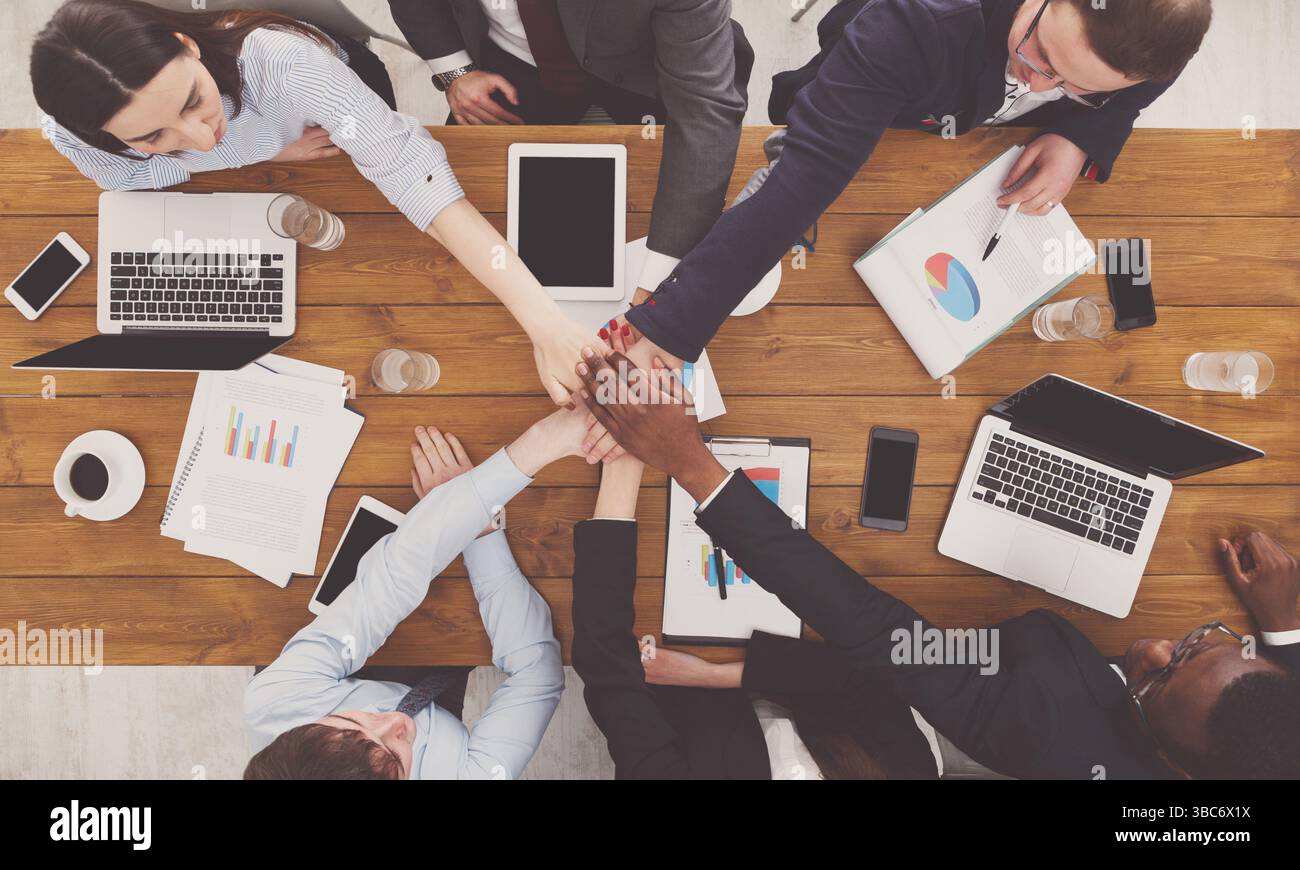 Teamwork and teambuilding concept in office, people connect hand Stock ...