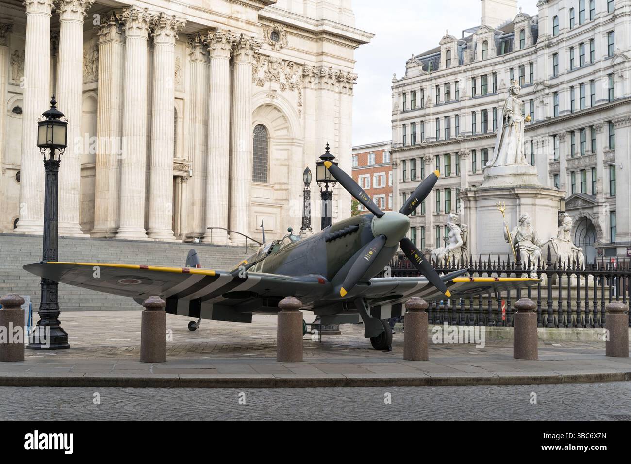 A Spitfire aircraft displayed outside St. Paul’s Cathedral in London ...
