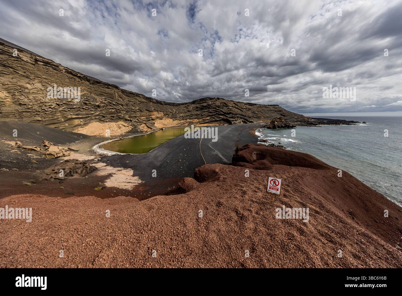 Green volcanic lake El Lago Verde / Charco de los Clicos with a black ...