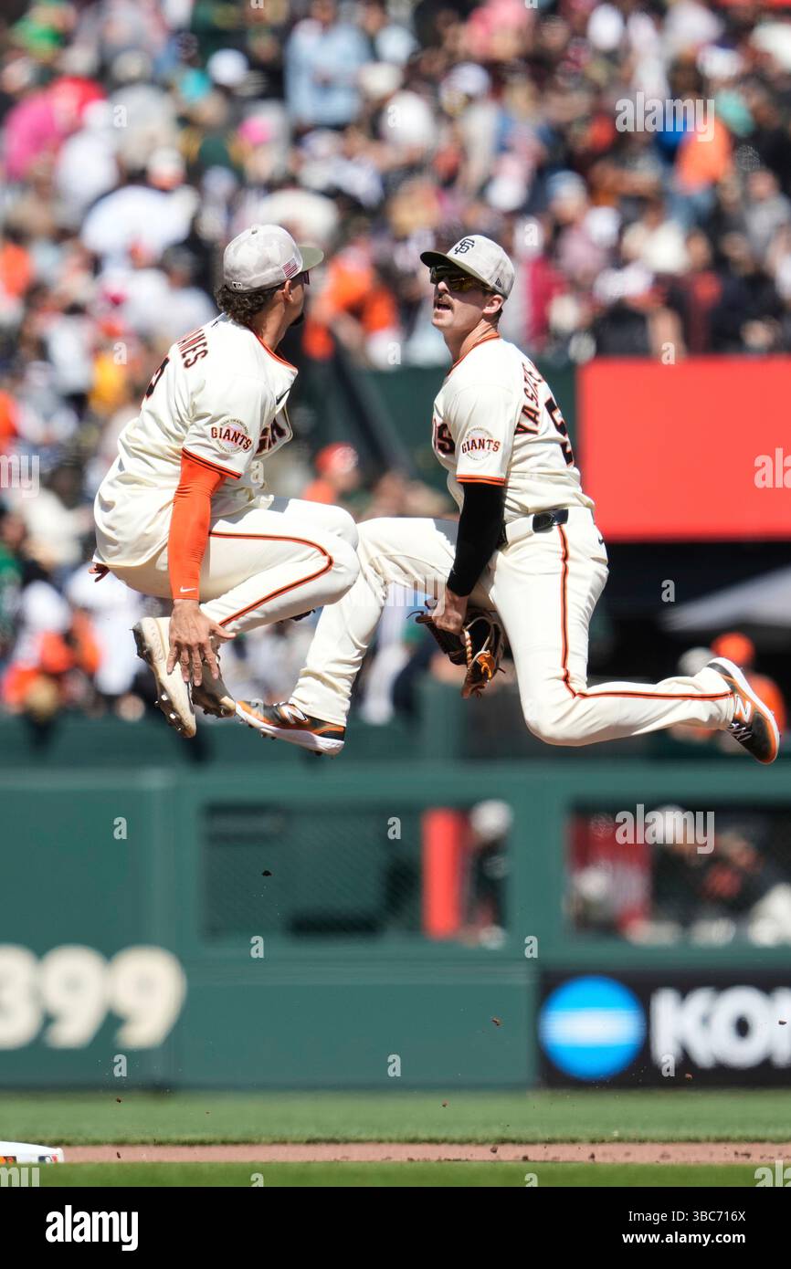 San Francisco Giants shortstop Willy Adames, left, and right fielder ...