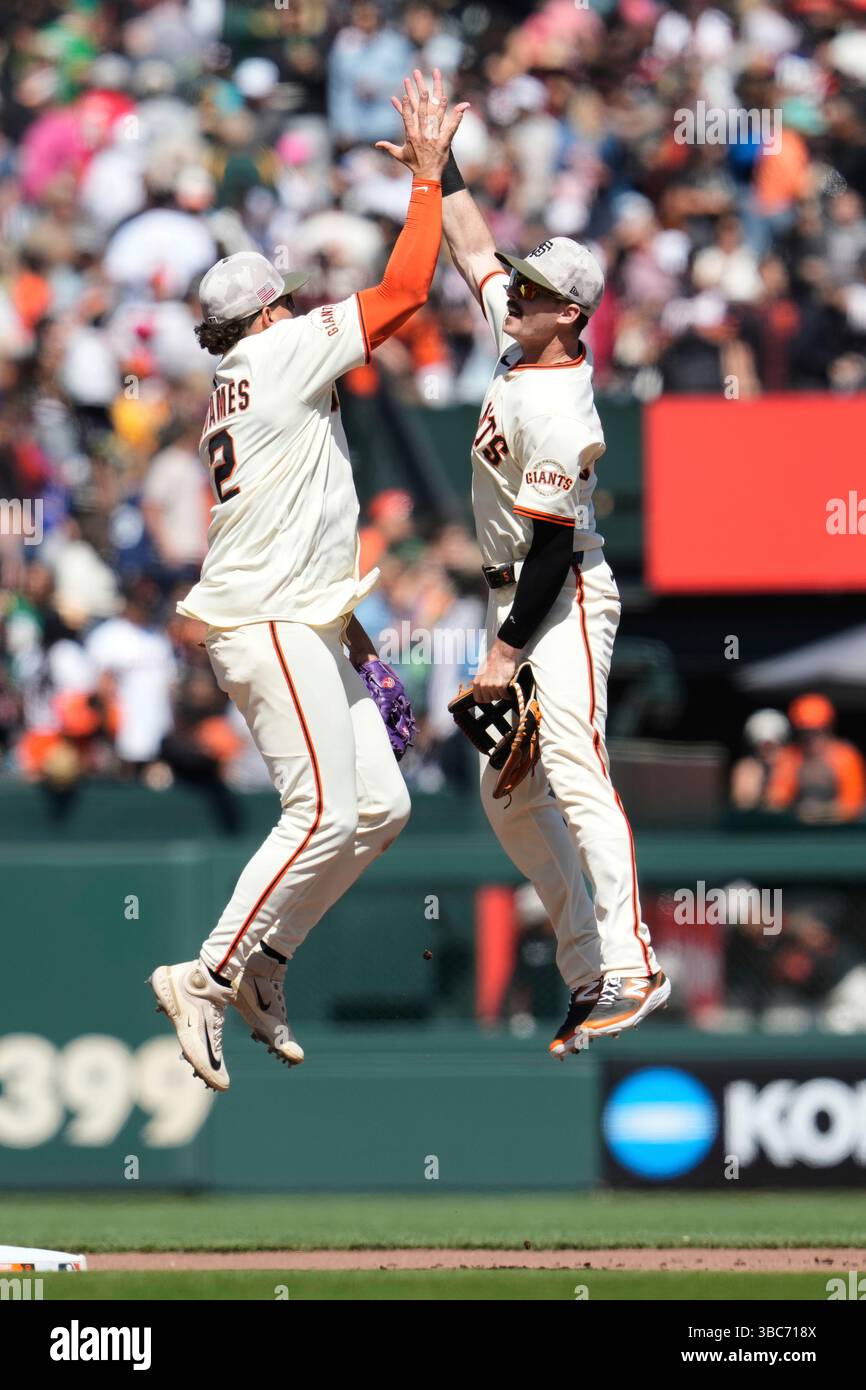 San Francisco Giants shortstop Willy Adames, left, and right fielder ...