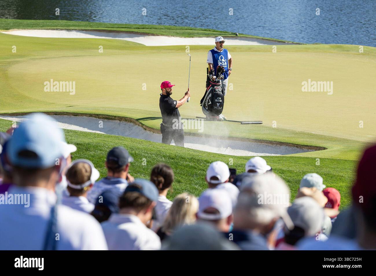 Captain Jon Rahm of Legion XIII hits his shot from a bunker on the 14th ...