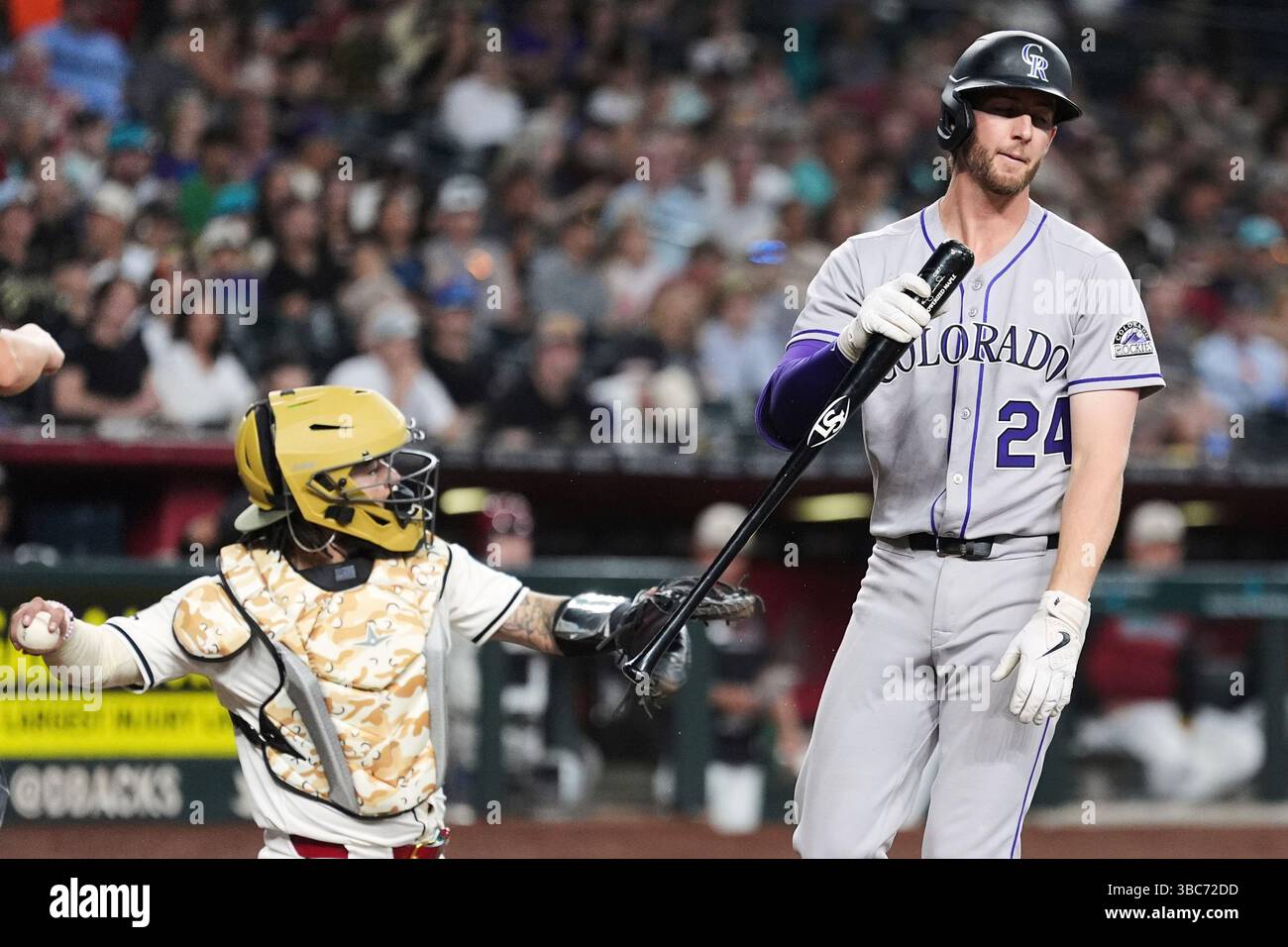 Colorado Rockies' Ryan McMahon (24) is called out on strikes as Arizona ...