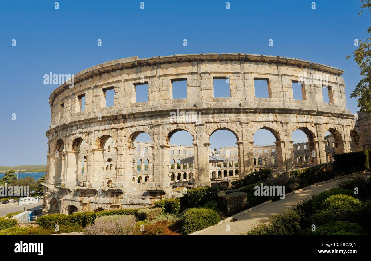 Ancient heritage in Pula, Istria, Croatia. Arches of monumental ancient ...