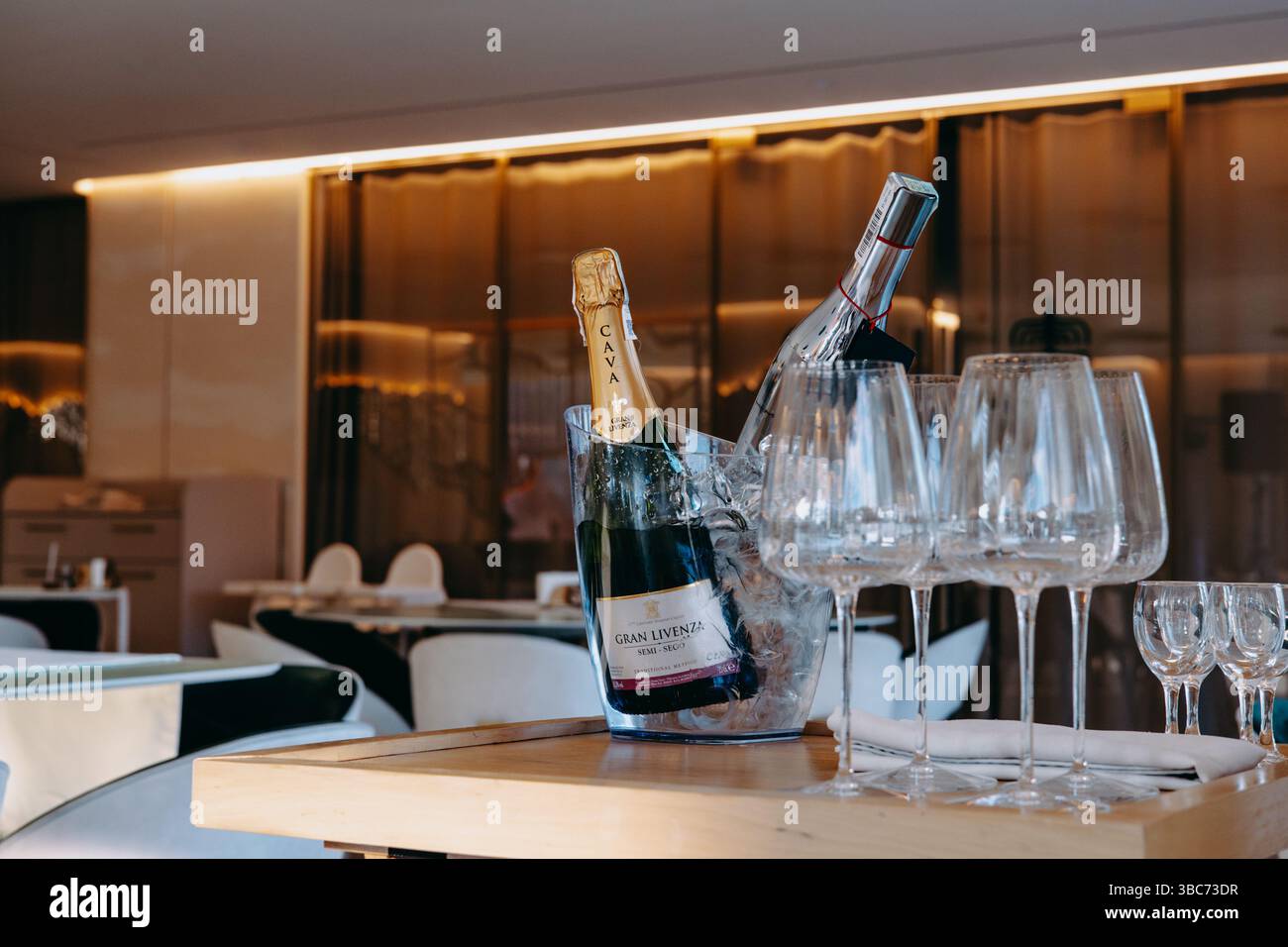 Bukovel, Ukraine 7 May 2025 A bottle of Cava with glasses, ready for a ...