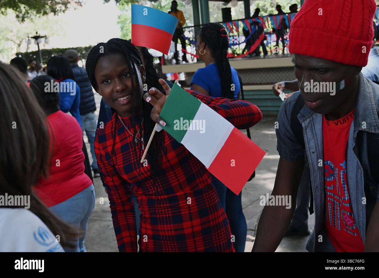 Tijuana, Mexico. 18th May, 2025. A Haitian migrant teen pastes together ...