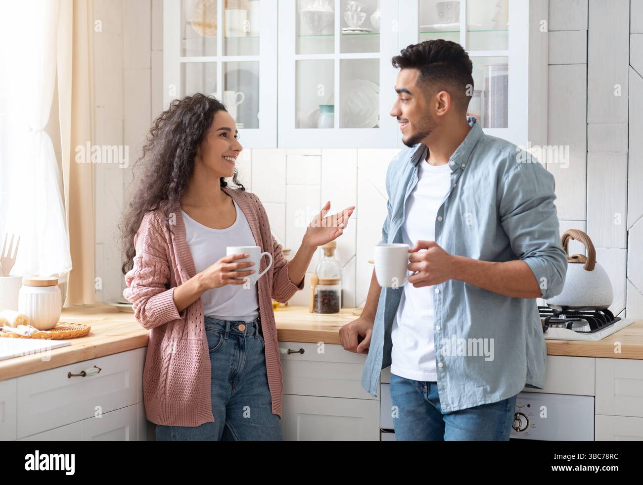 Home Leisure. Cheerful Middle Eastern Couple Spending Time In Kitchen ...