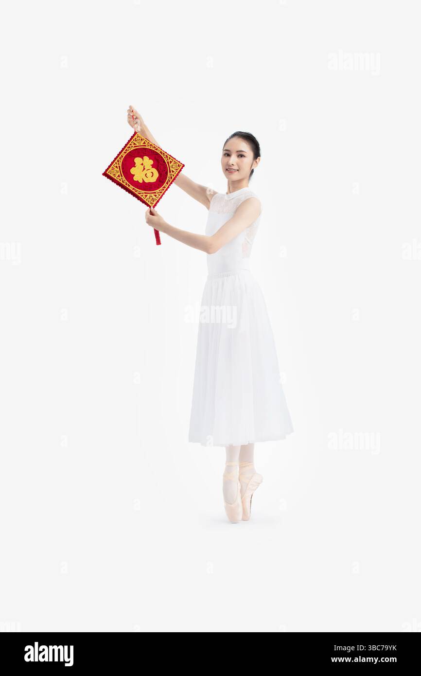 a ballet dancer holding Spring Festival decorations Stock Photo - Alamy