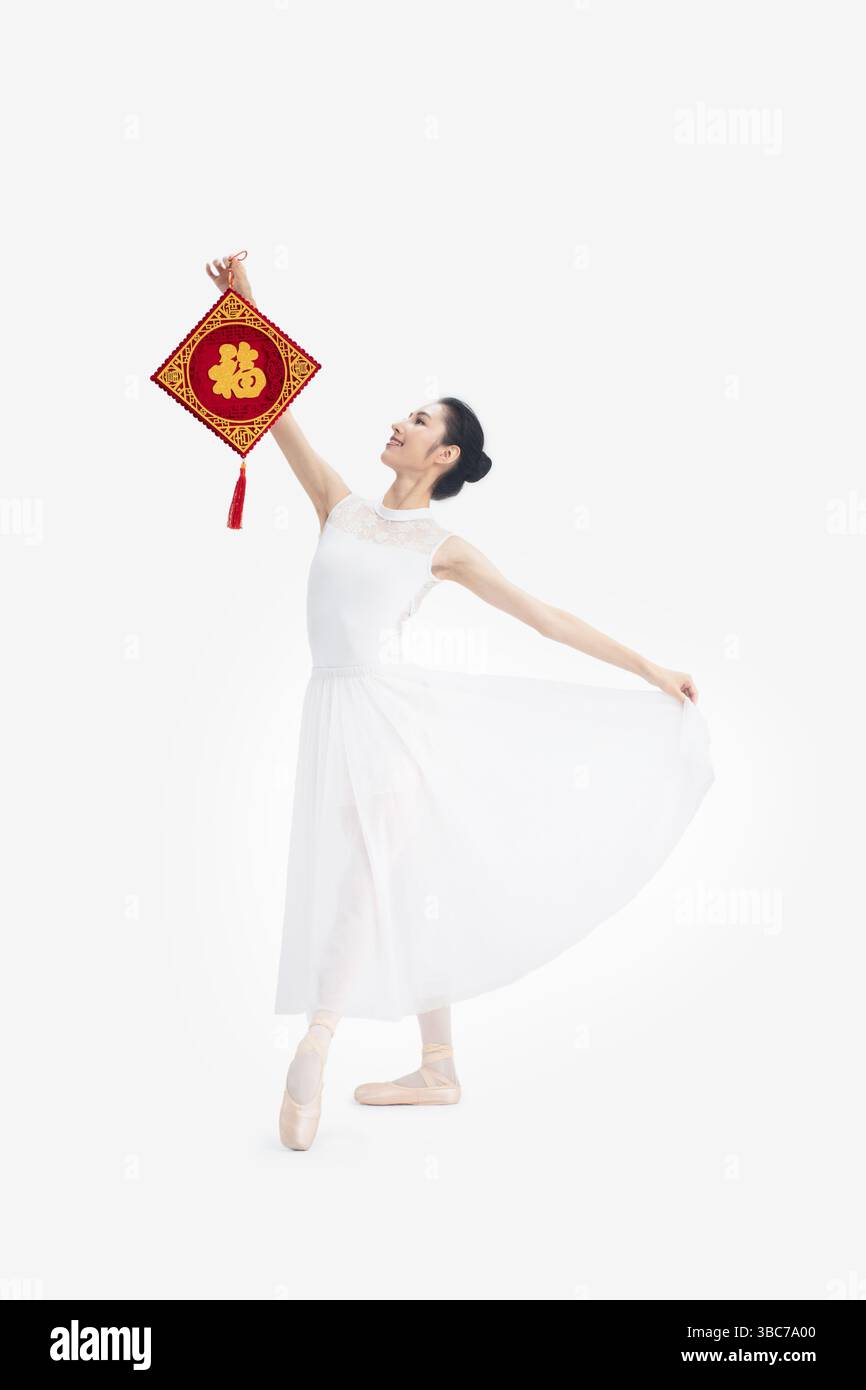 a ballet dancer holding Spring Festival decorations Stock Photo - Alamy