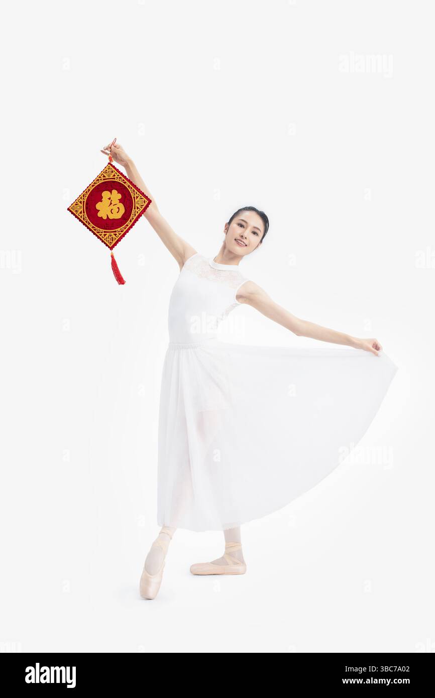 a ballet dancer holding Spring Festival decorations Stock Photo - Alamy