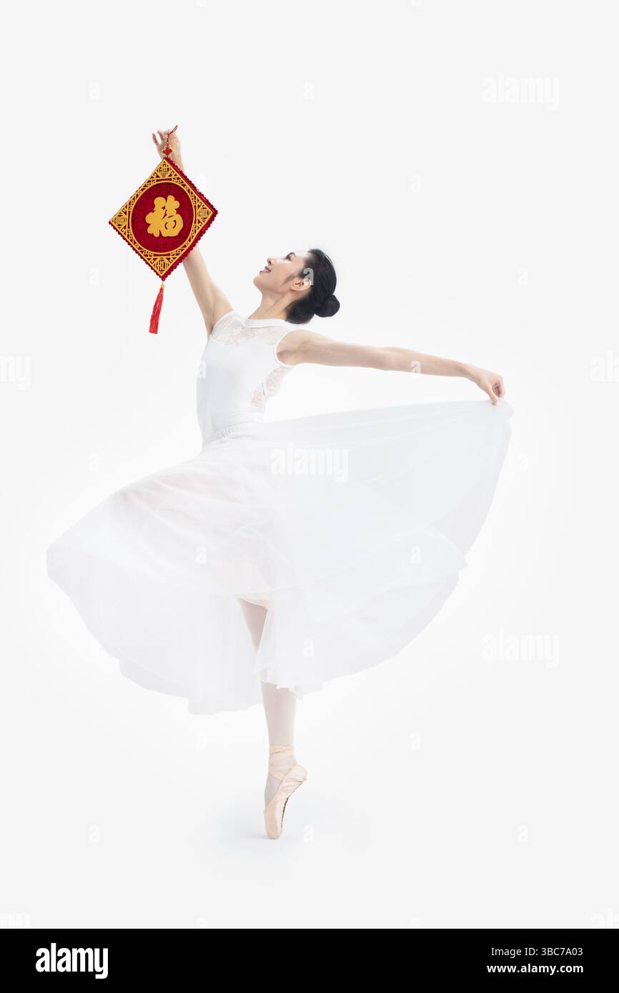 a ballet dancer holding Spring Festival decorations Stock Photo - Alamy