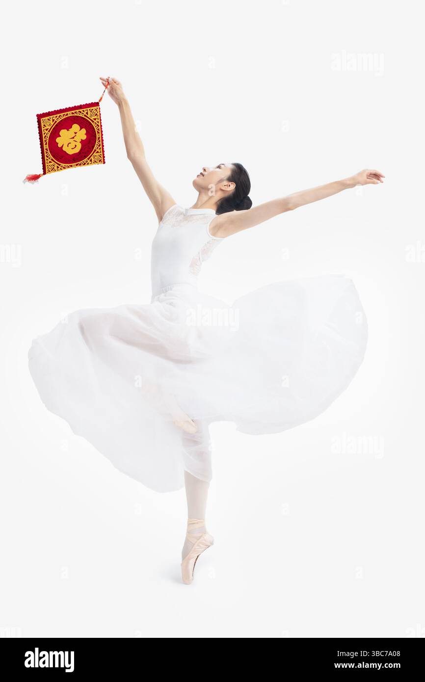 a ballet dancer holding Spring Festival decorations Stock Photo - Alamy