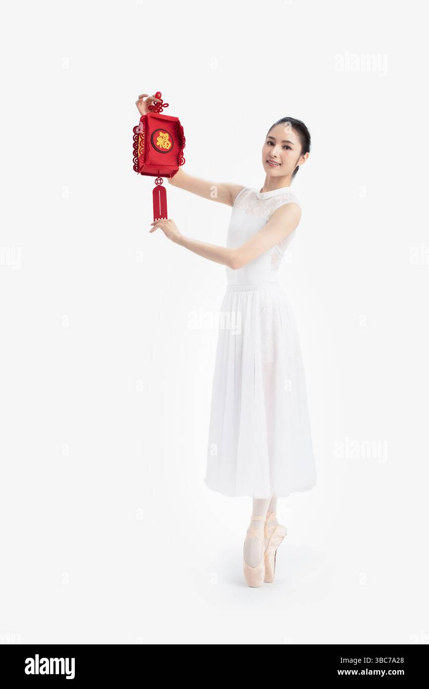 a ballet dancer holding Spring Festival decorations Stock Photo - Alamy