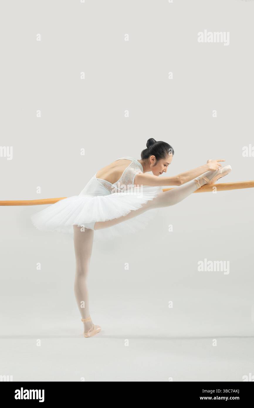a ballet dancer practicing at the barre Stock Photo - Alamy