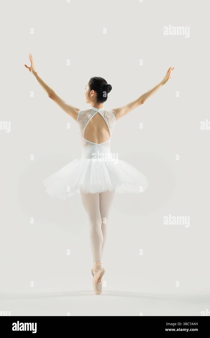 a ballet dancer with arms outstretched, back to the camera Stock Photo ...