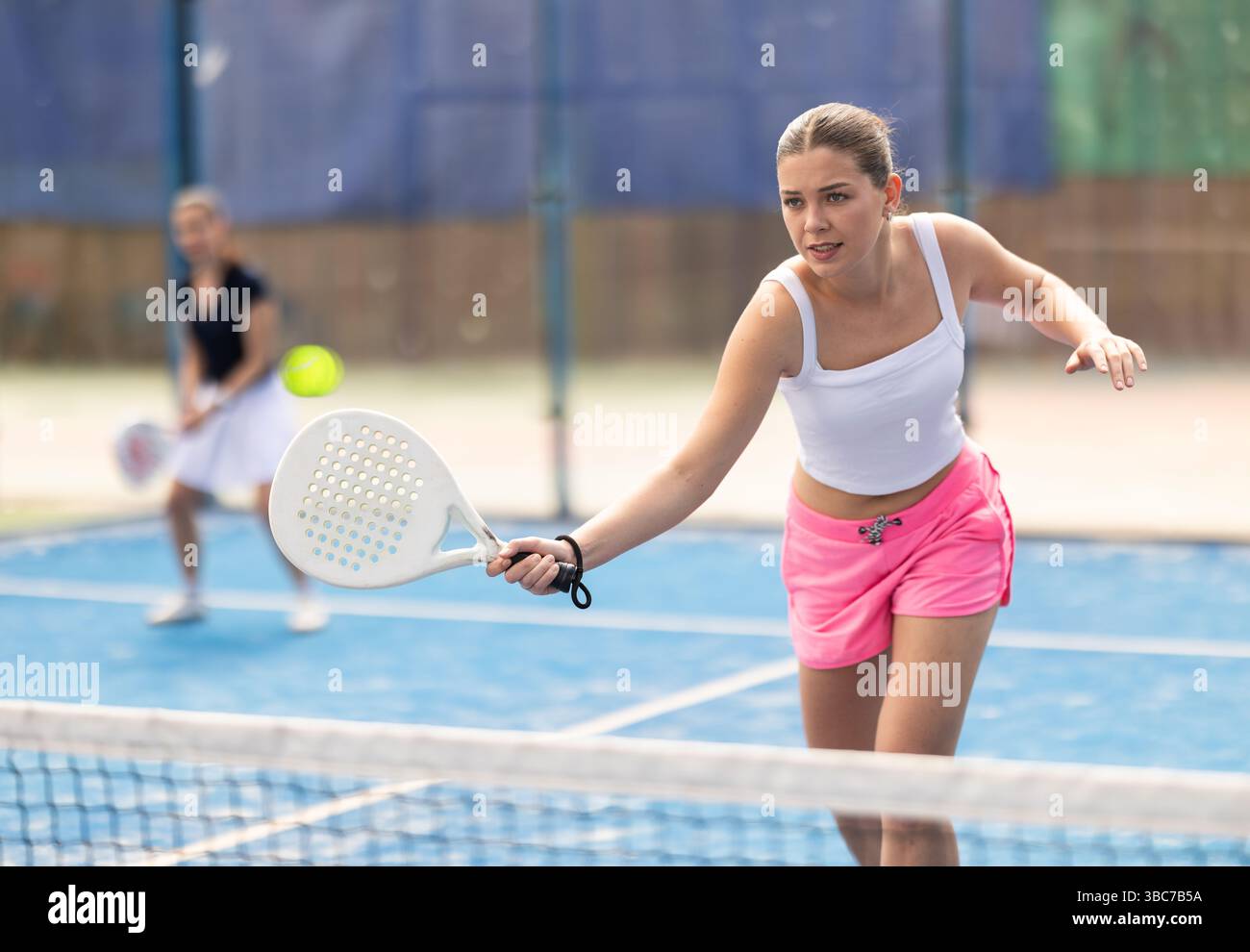 Female tennis player standing behind hi-res stock photography and ...