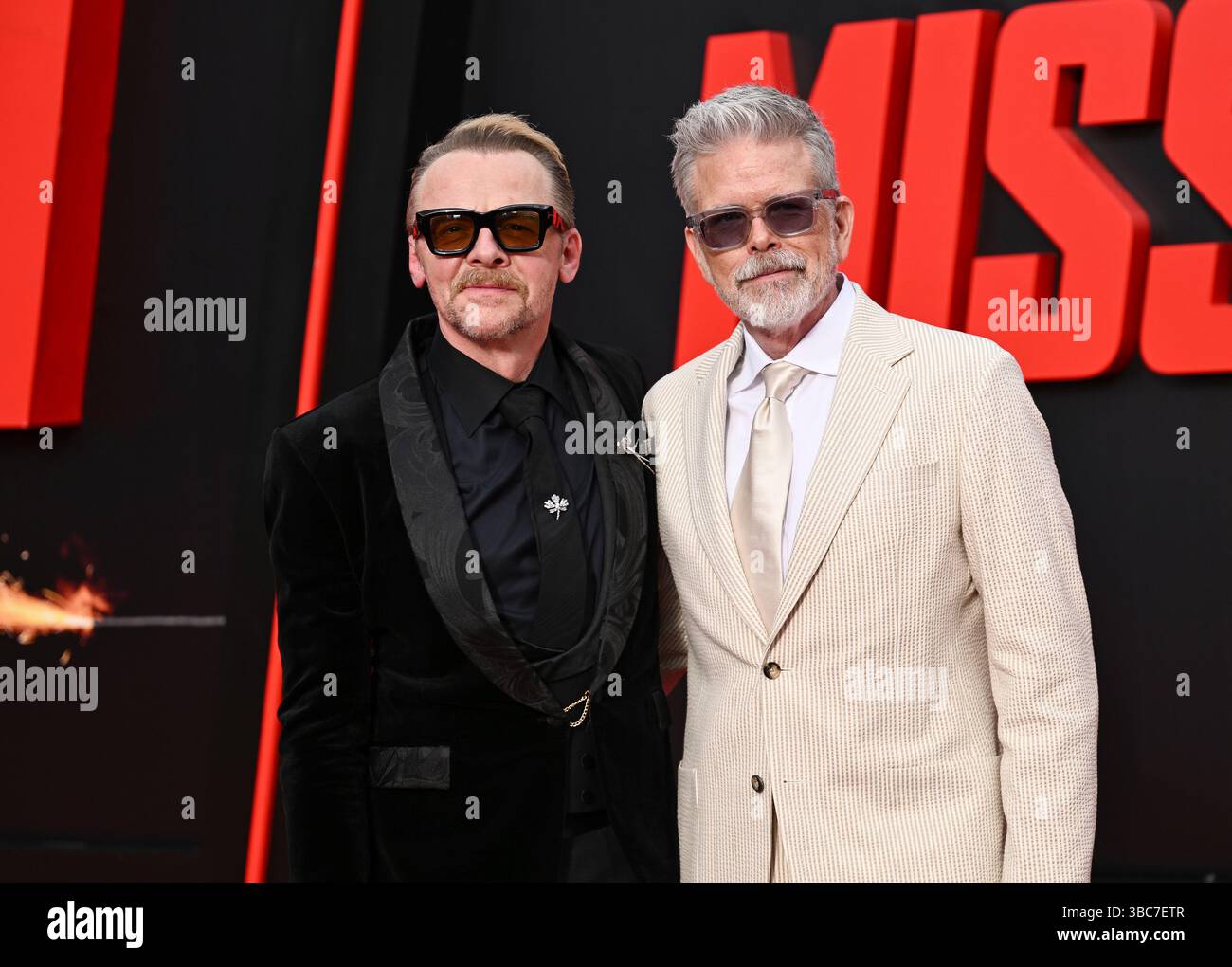 Simon Pegg, left, and Chris McQuarrie attend the "Mission: Impossible ...