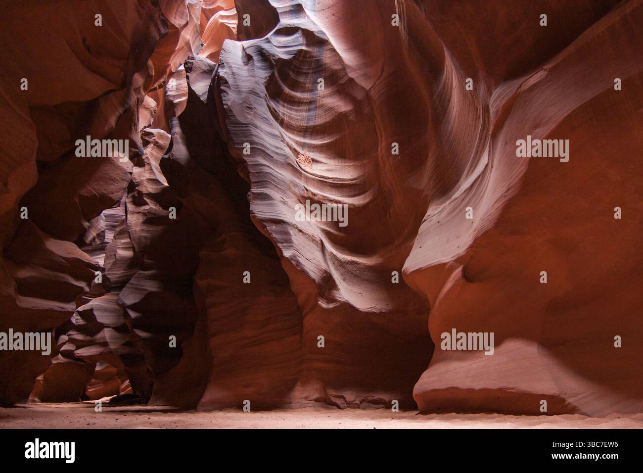 Curved sandstone walls and soft natural light define Antelope Canyon, a ...