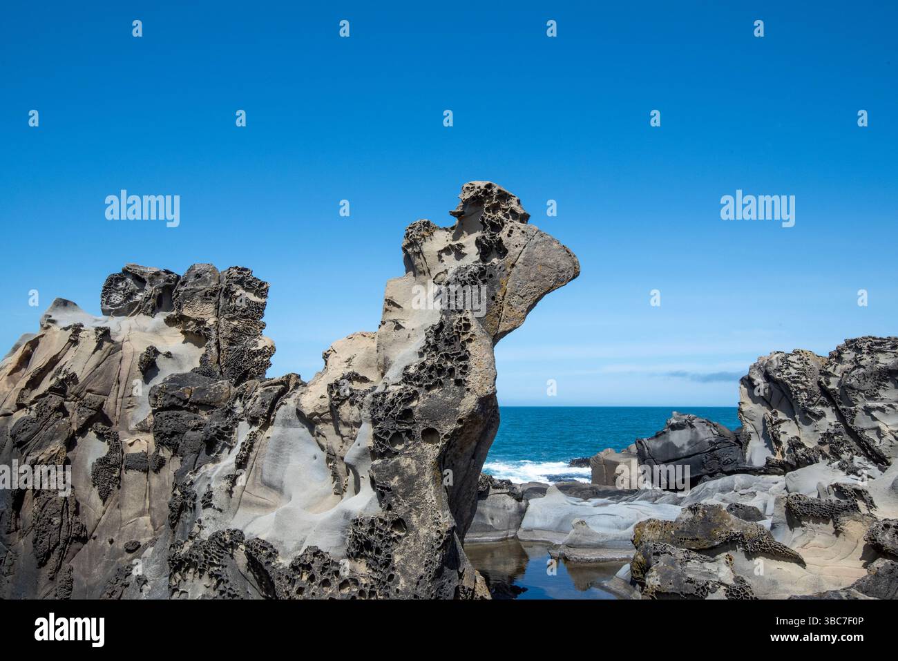 Tafoni and tilted layers of sandstone that formed deep below the sea ...