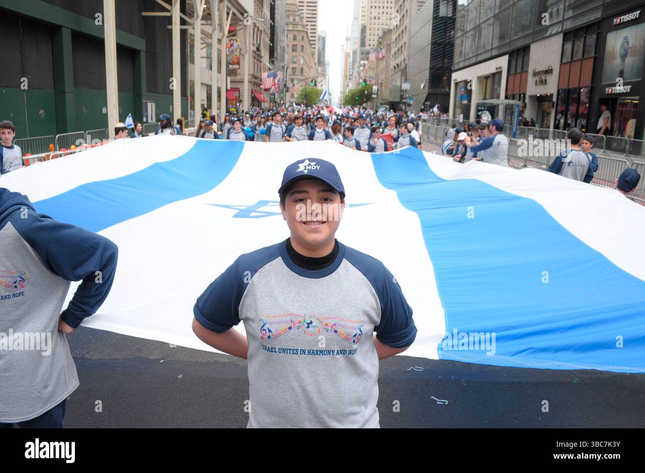 New York, USA. 18th May, 2025. Parade participants hold a large Israeli ...