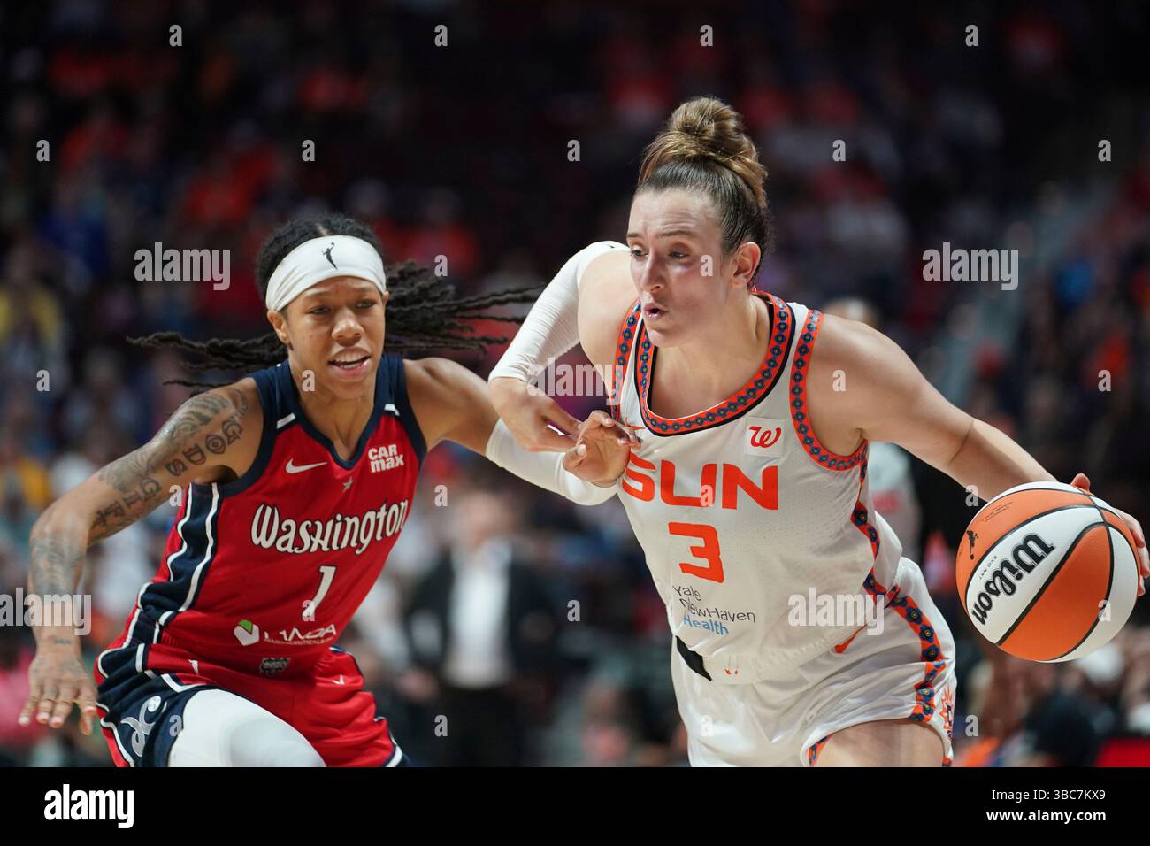 Connecticut Sun guard Marina Mabrey (3) drives the ball around ...
