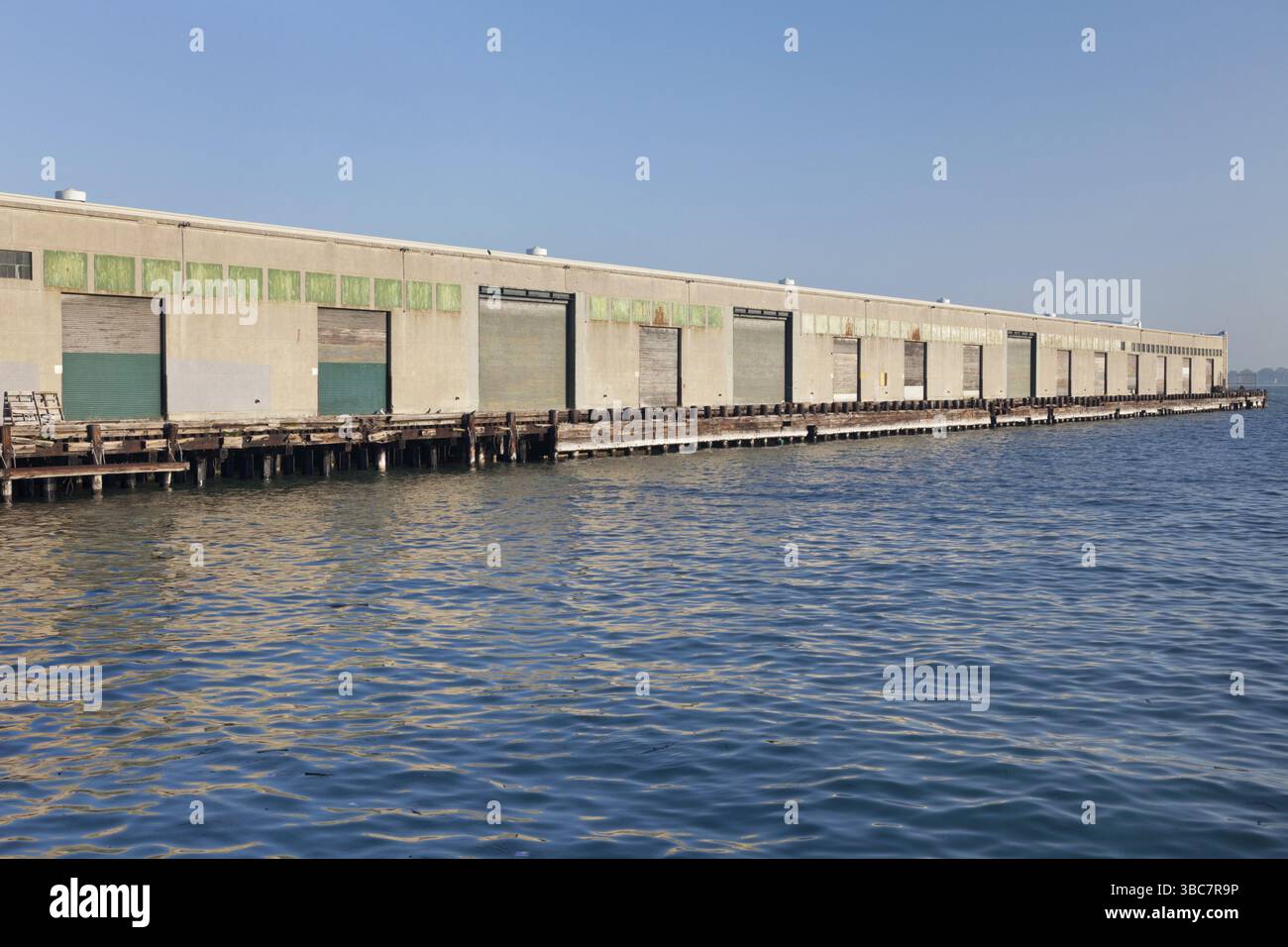 Industrial pier in San Francisco waterfront with storage gates Stock ...