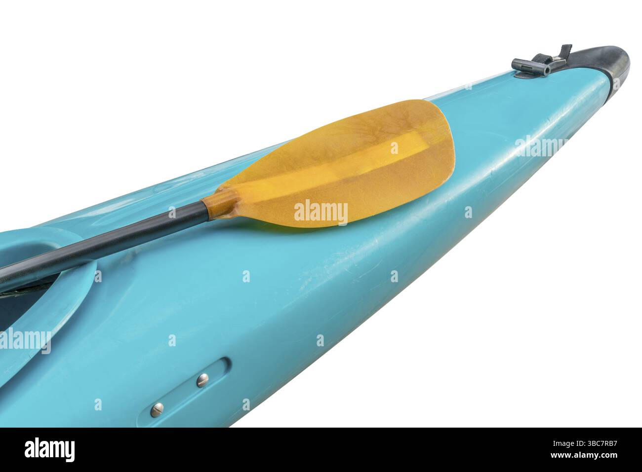 A bow of used old style blue plastic whitewater kayak with a paddle ...