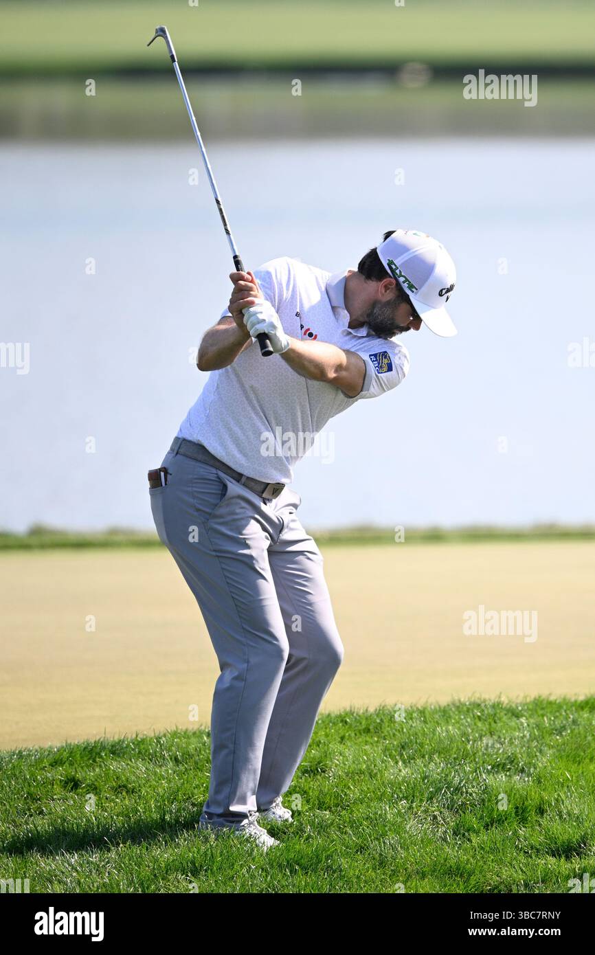Adam Hadwin, of Canada, hits onto the sixth green during the final ...