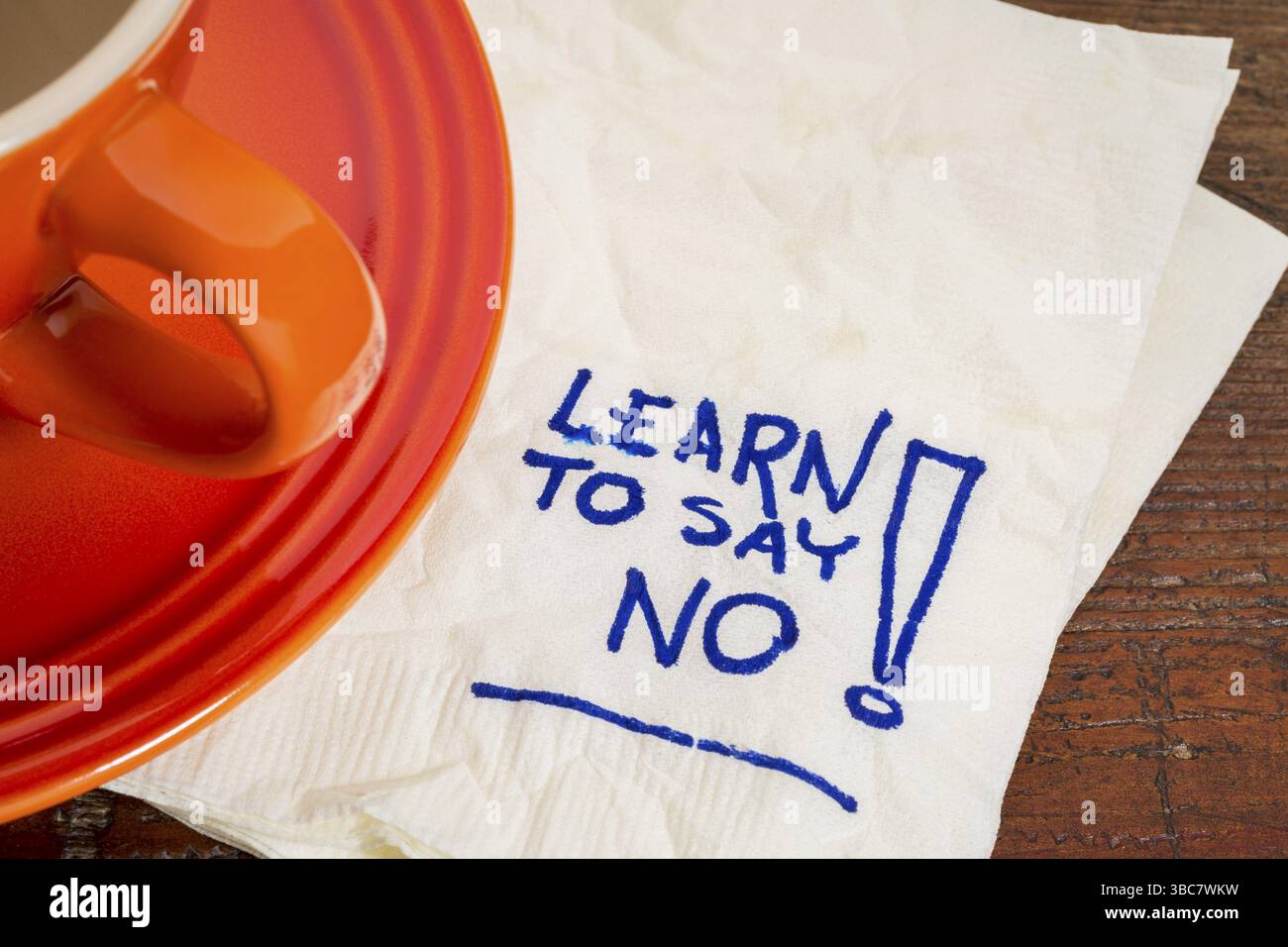 Learn to say no advice - handwriting on a napkin with cup of coffee ...