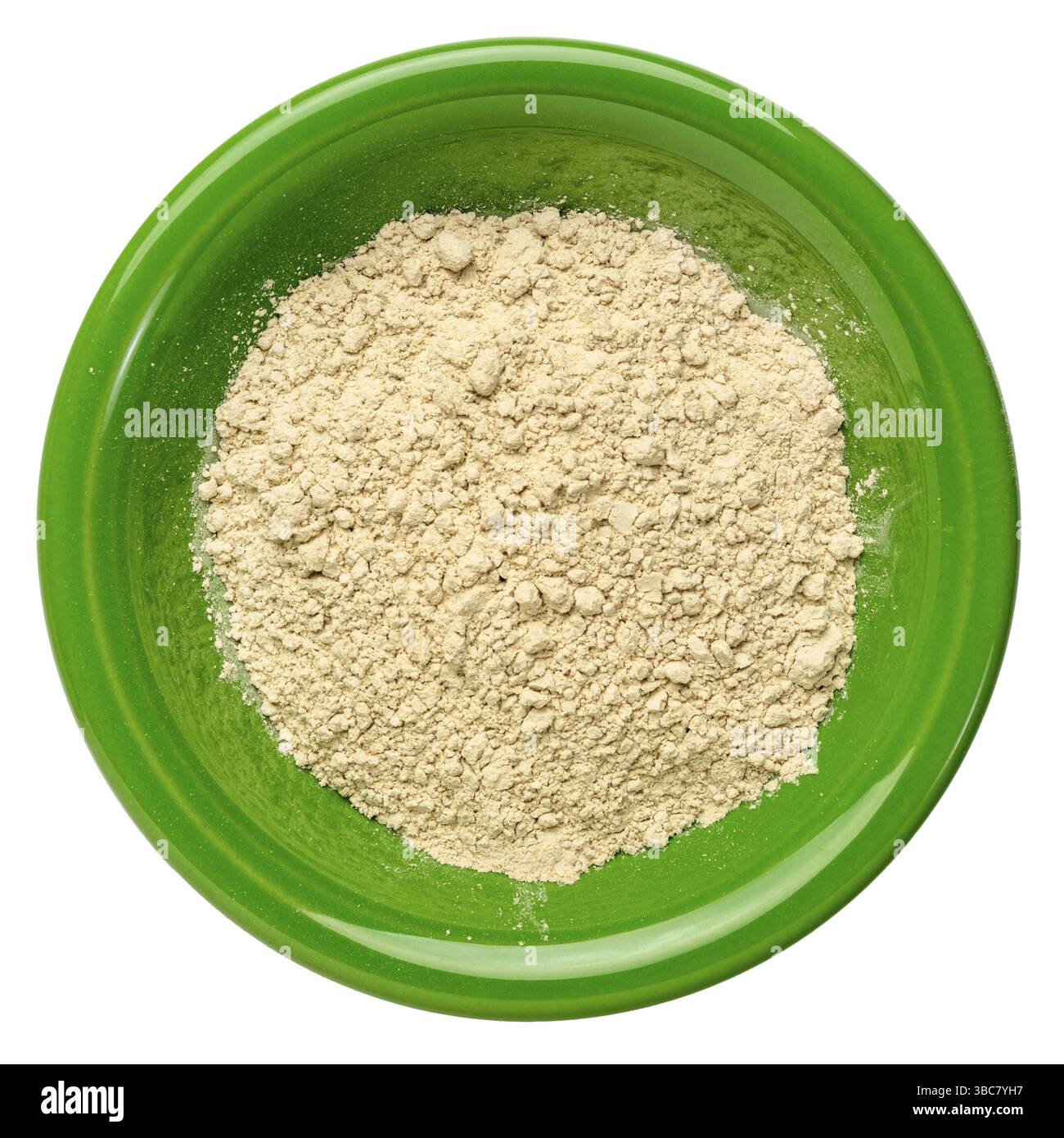 Ashwagandha root (aka Indian ginseng) powder in an isolated green ...