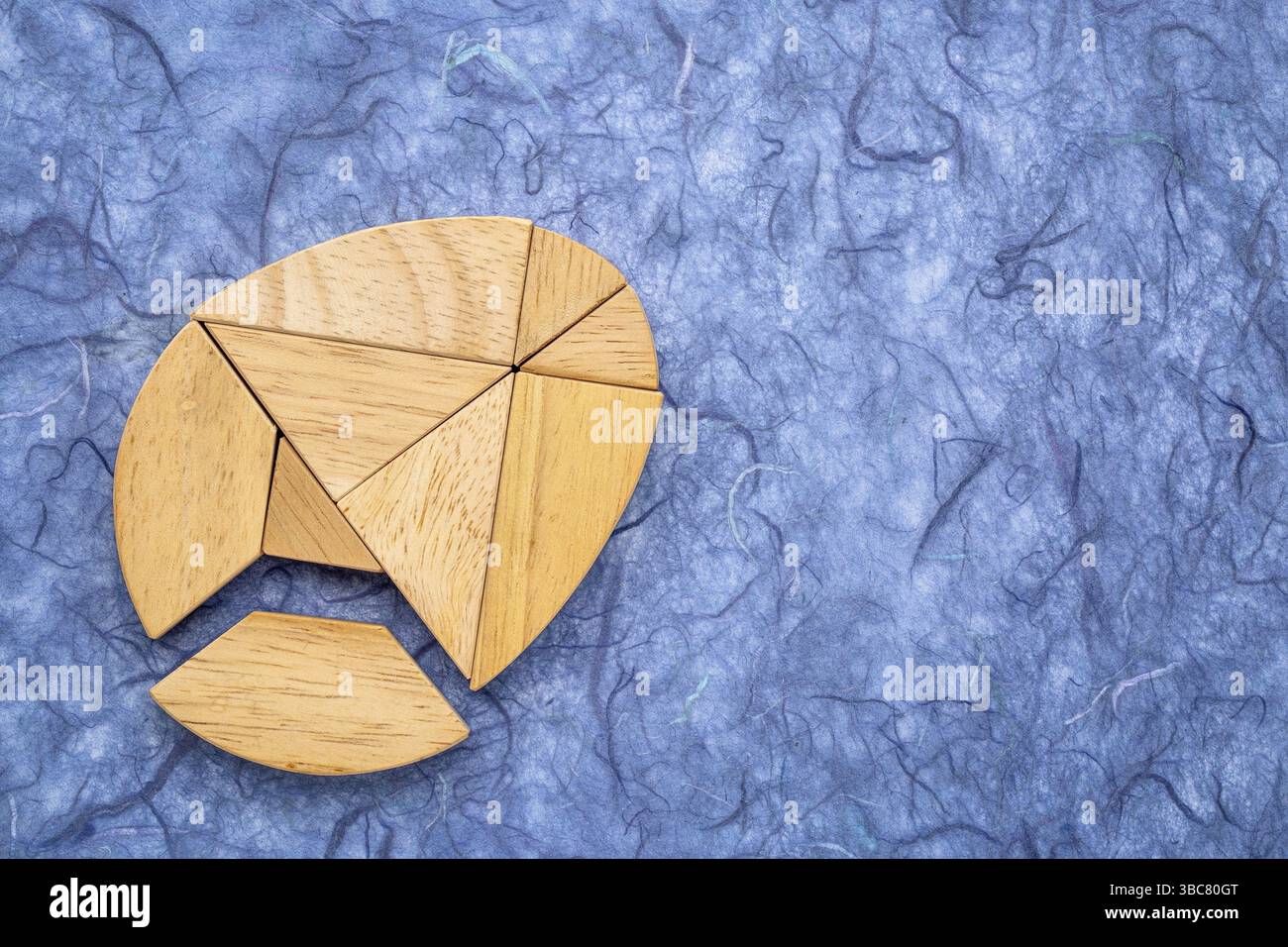 Egg version of tangram, ancient Chinese puzzle - wooden pieces on a ...